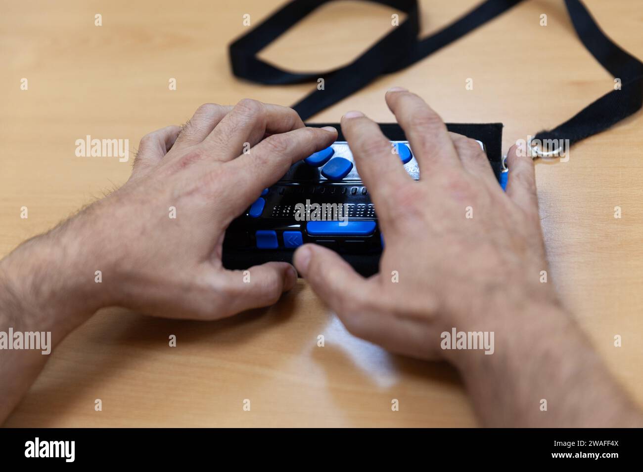 Blind or visually impaired person typing a smart Brailler Stock Photo ...