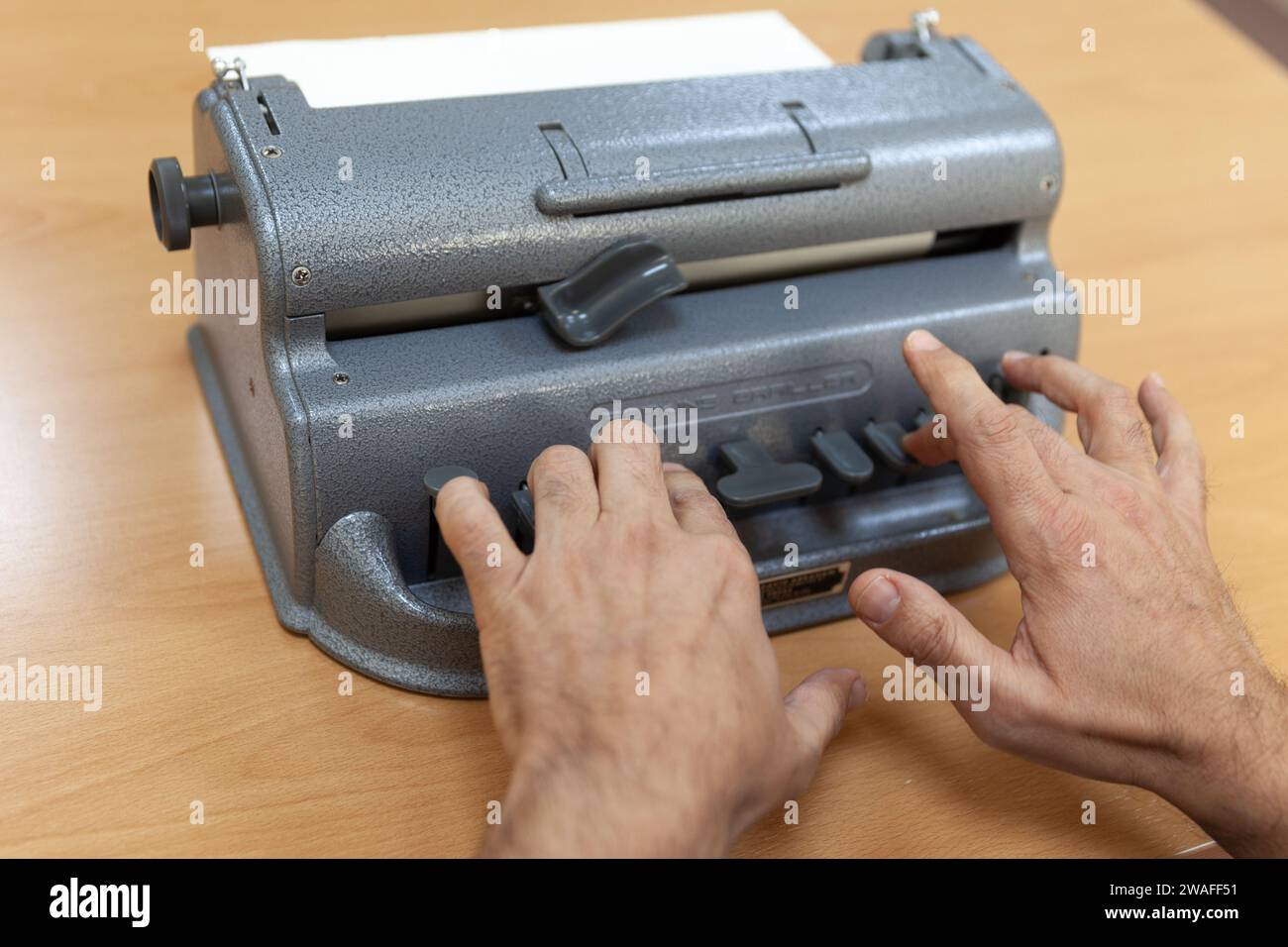 Blind or visually impaired person typing a Perkins Brailler Stock Photo ...
