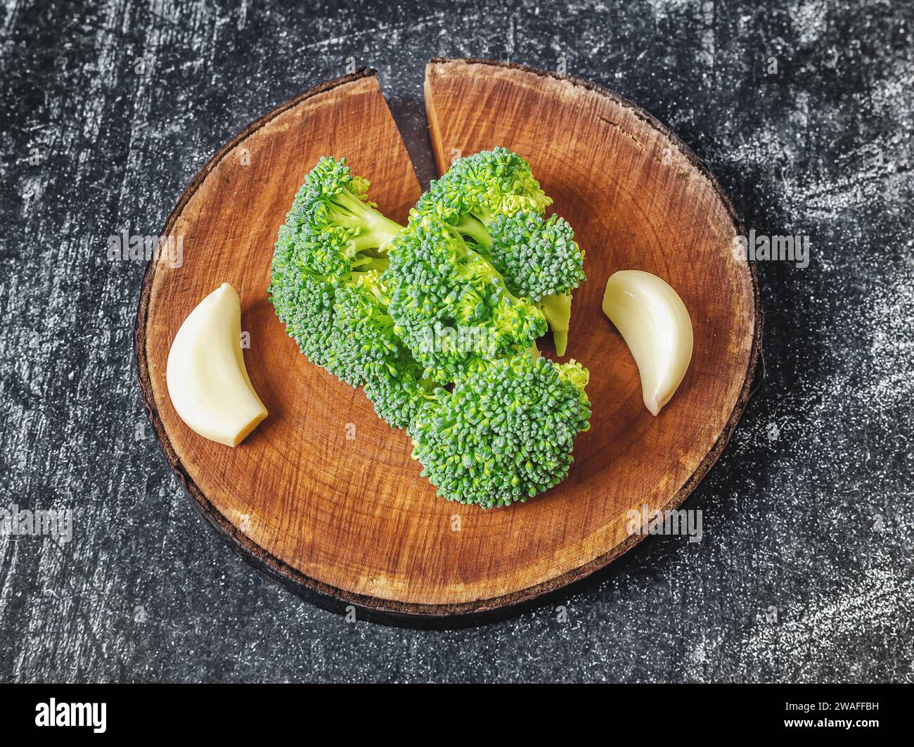 Green broccoli and garlic - still life image of food background. Top ...