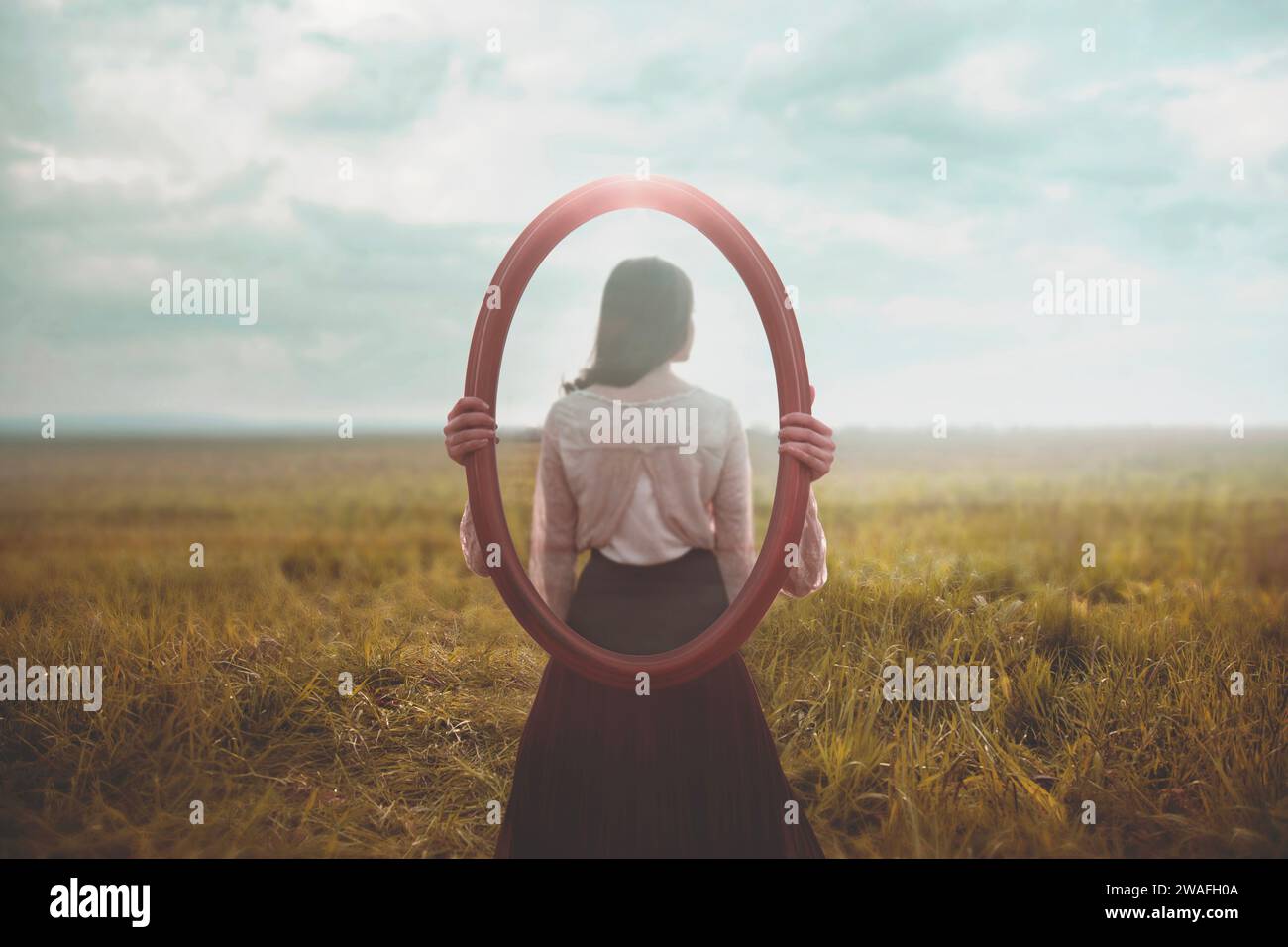 woman holding a mirror who is mirrored appears from behind, identity ...