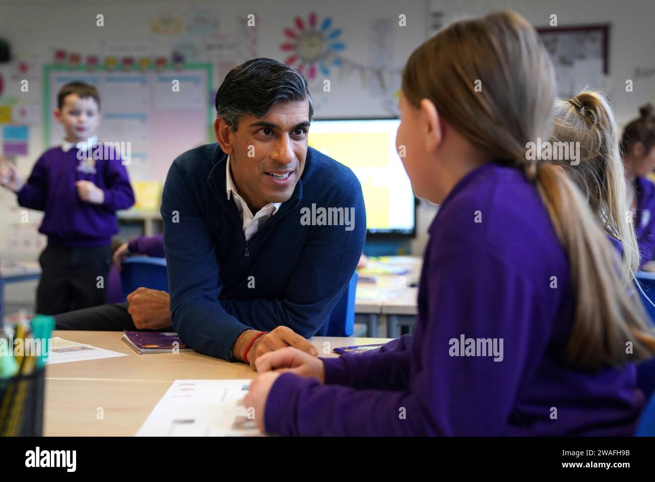 Britain's Prime Minister Rishi Sunak speaks to children, during a visit ...