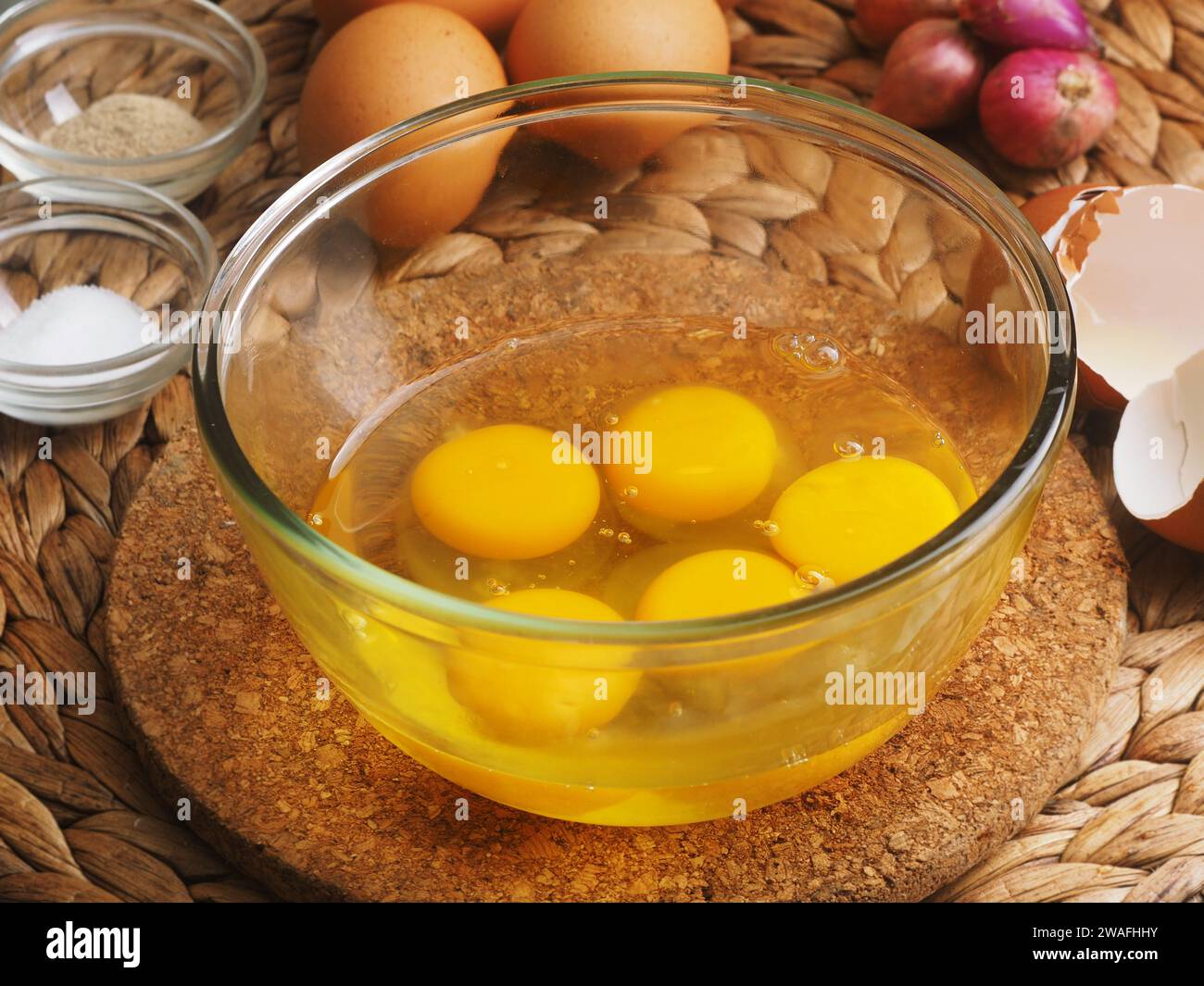 Preparing making telur dadar, Indonesian omelet, with ingredient eggs ...