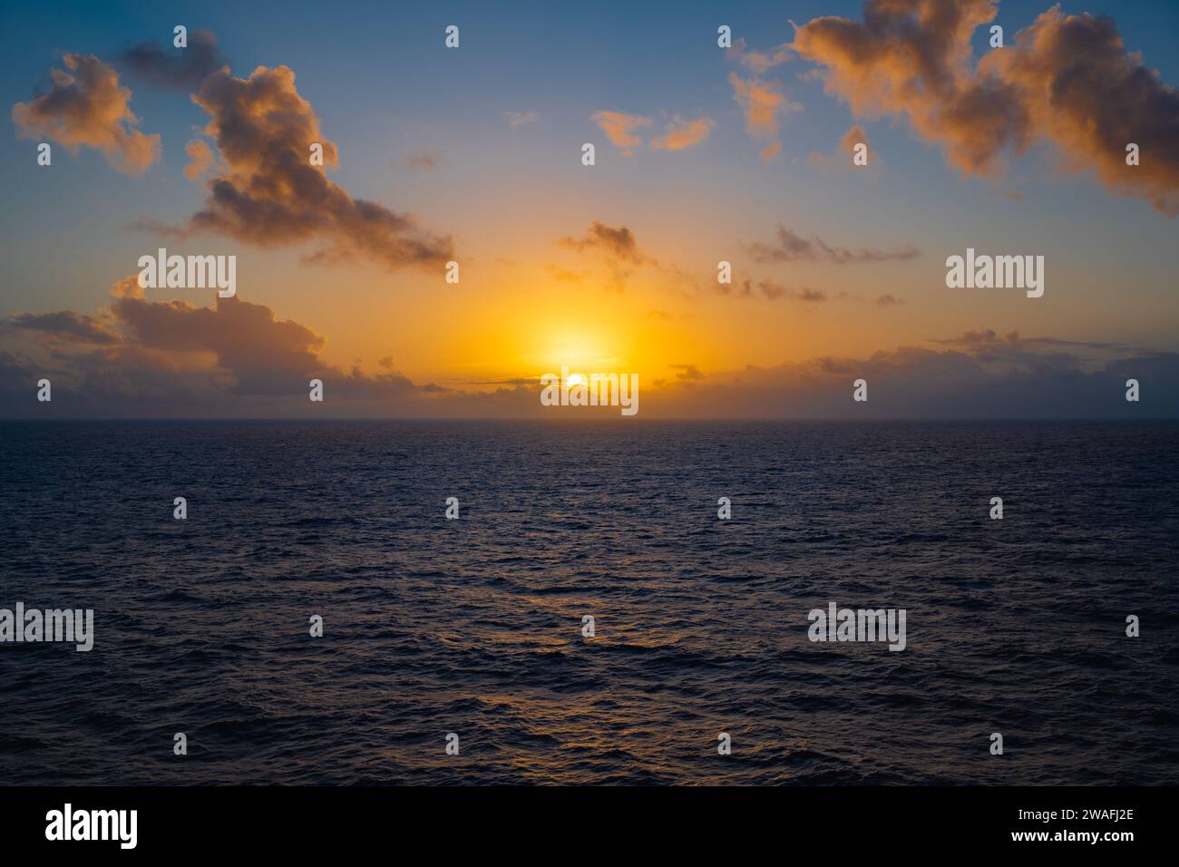 A stunning vista of a vibrant yellow and blue sunset illuminating the ...