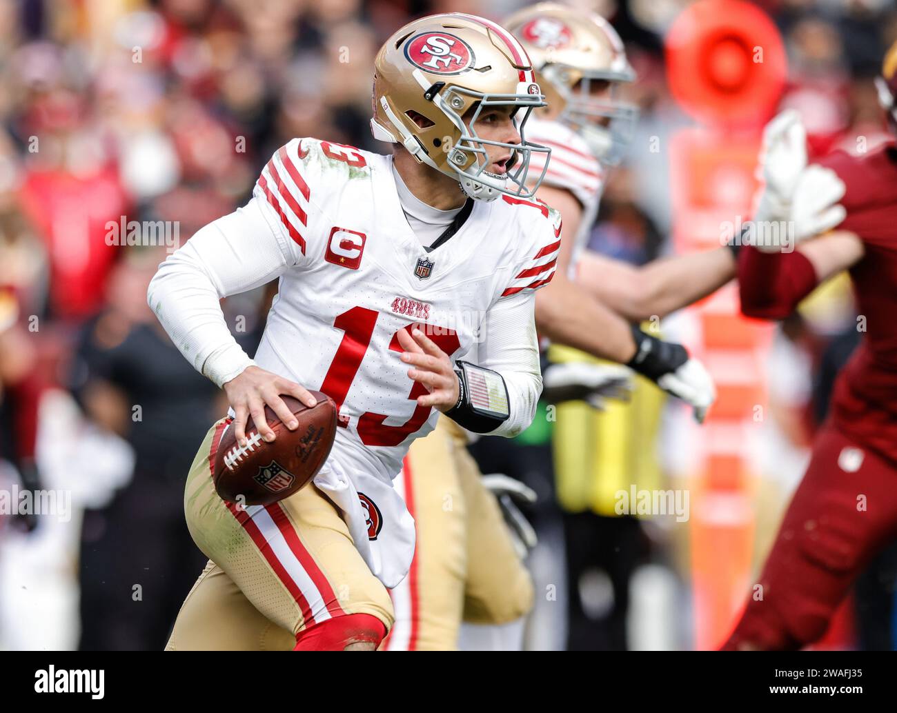 San Francisco 49ers quarterback Brock Purdy (13) scrambles, searching ...