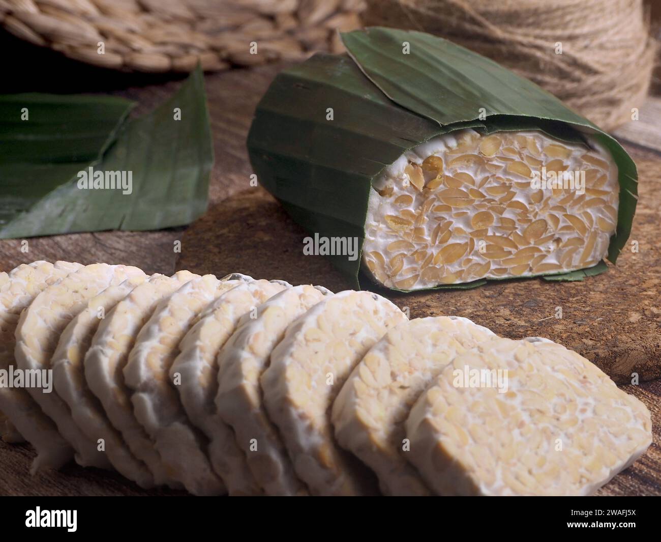 Raw tempeh wrapped in banana leaves, Indonesian traditional food ...
