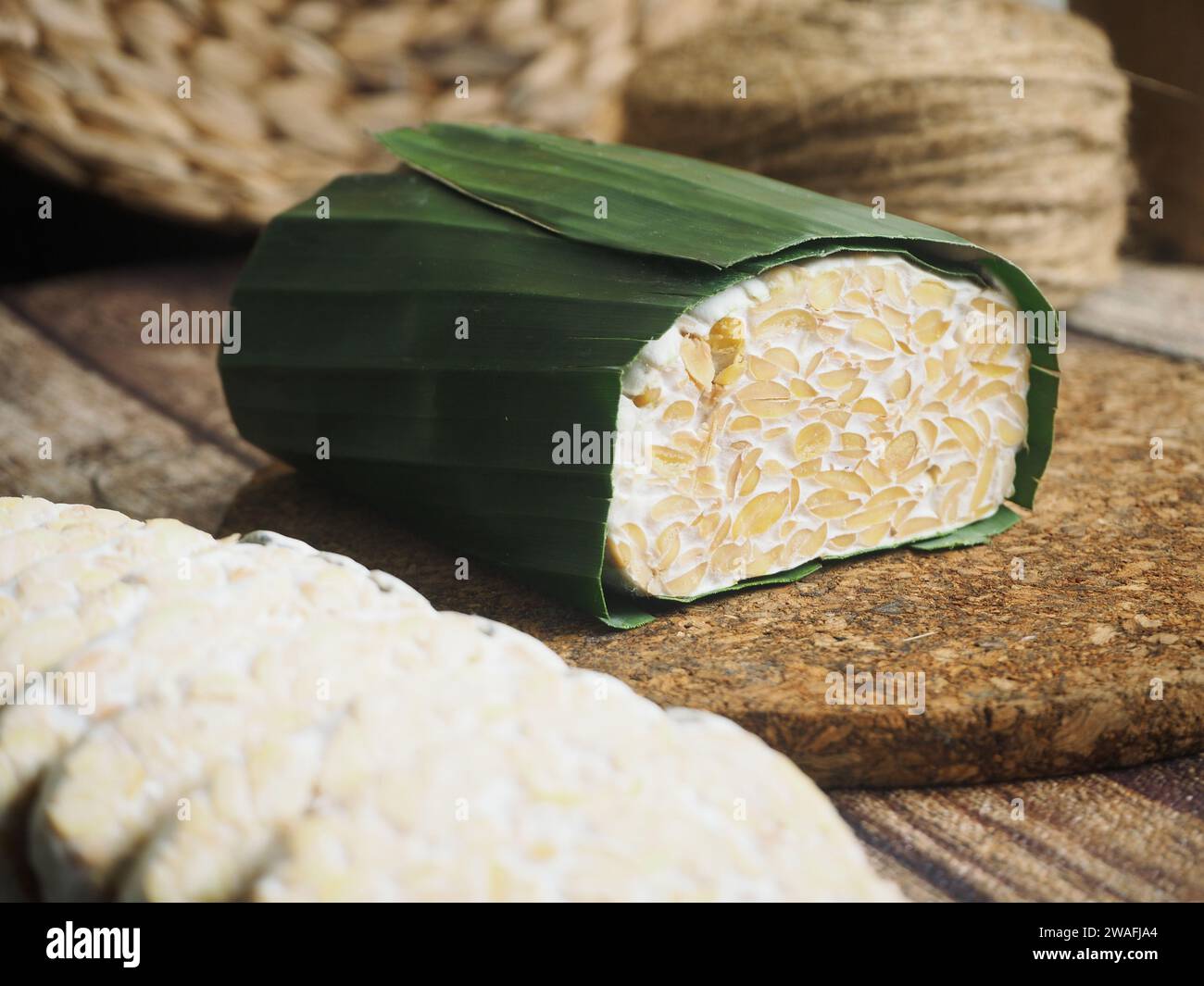 Raw tempeh wrapped in banana leaves, Indonesian traditional food ...