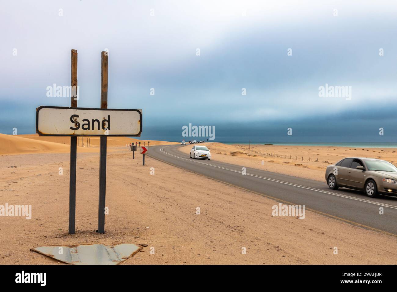 A warning sign along a road through the Namib desert states the ...