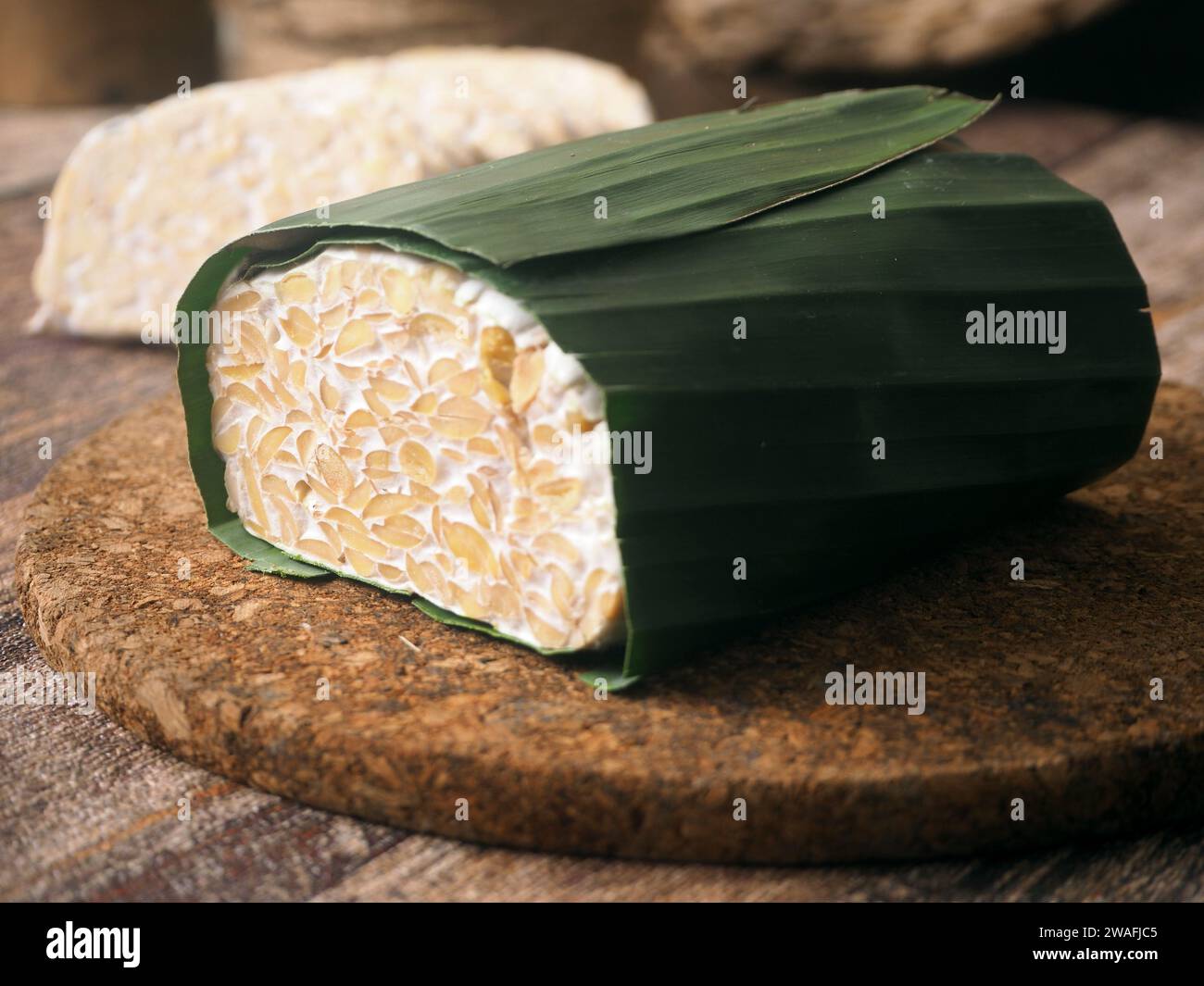 Raw tempeh wrapped in banana leaves, Indonesian traditional food ...