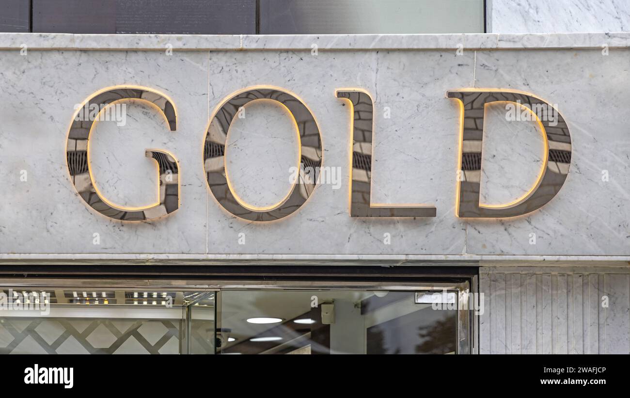 Gold 3d Sign With Glow at Marble Wall Luxury Jewellery Shop Stock Photo ...