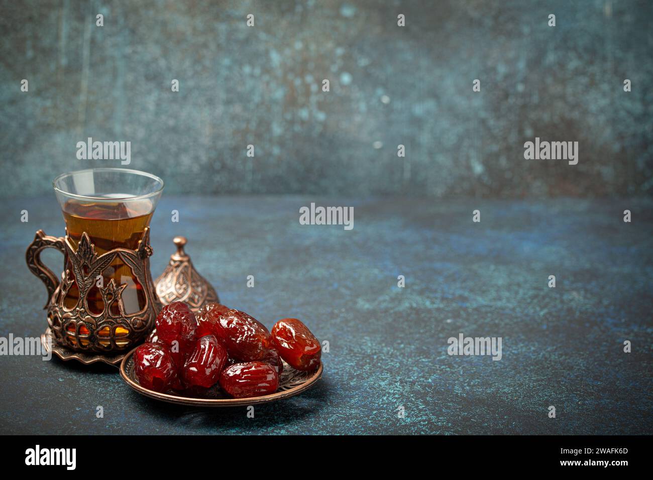 Breaking fasting with dried dates during Ramadan Kareem, Iftar meal ...
