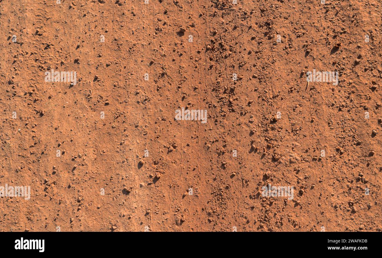 Stony ground texture background. Red Soil Tropical laterite soil or red ...