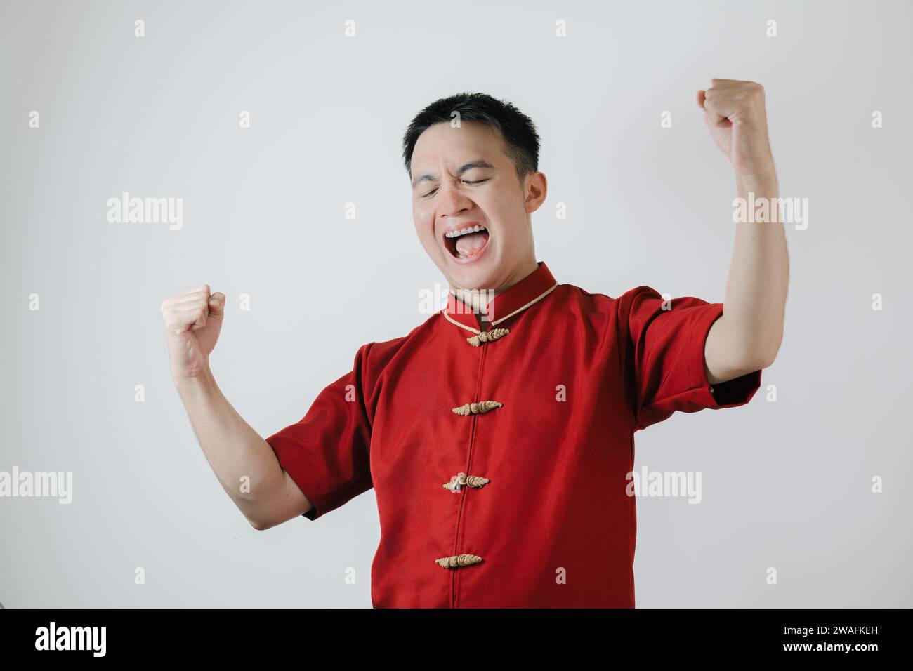 Happy and joyful expression of Asian man wearing Chinese traditional ...