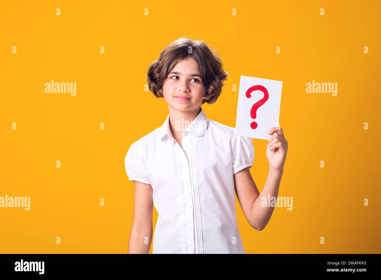 A portrain of kid girl holding question mark card. Children, idea and ...