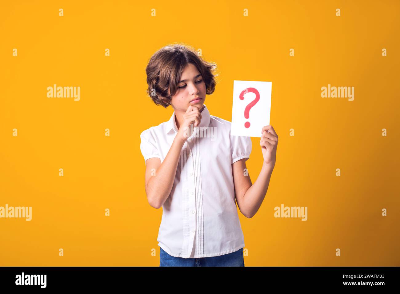 A portrain of kid girl holding question mark card. Children, idea and ...
