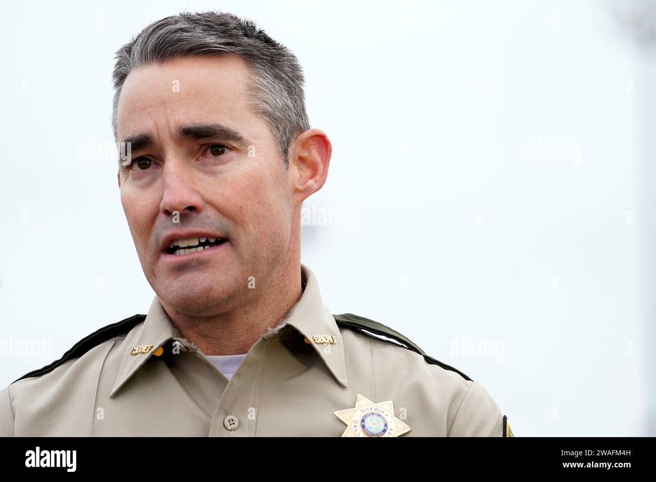 Dallas County (Iowa) Sheriff Adam Infante speaks outside Perry High ...