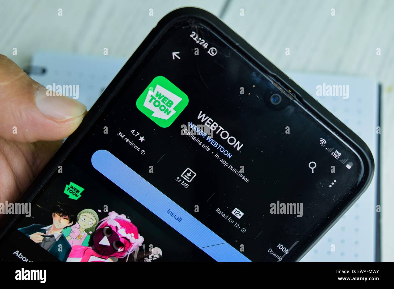 Webtoon application on Smartphone screen. Webtoon is a freeware web ...