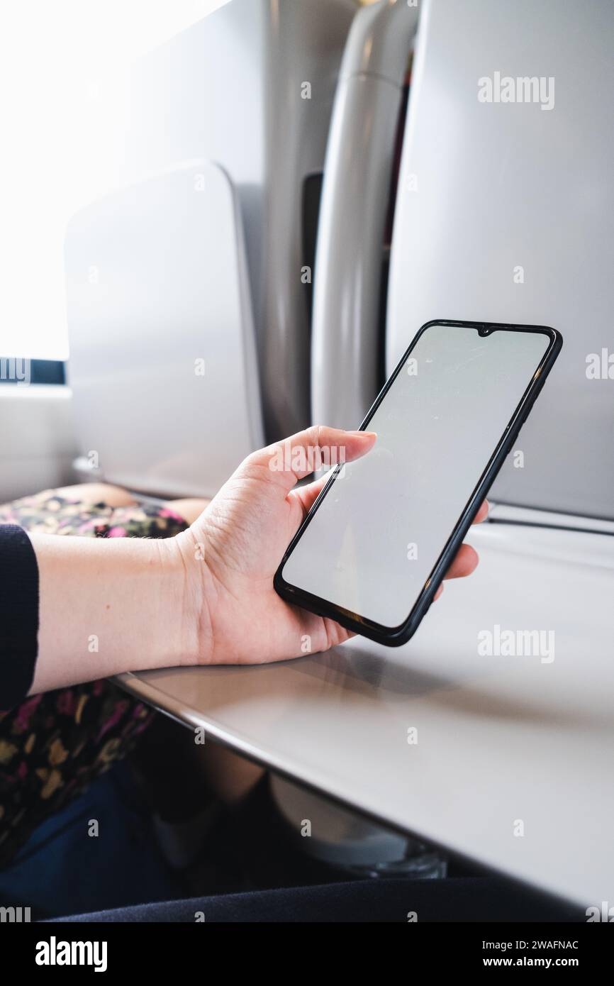 Modern work: mobile communication on train Stock Photo - Alamy