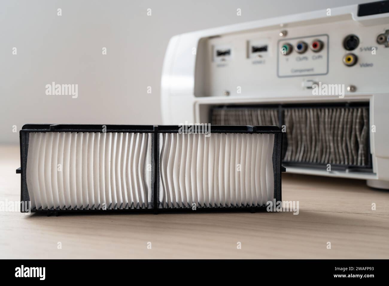 New air filter for household appliances. Replacing the dust filter ...