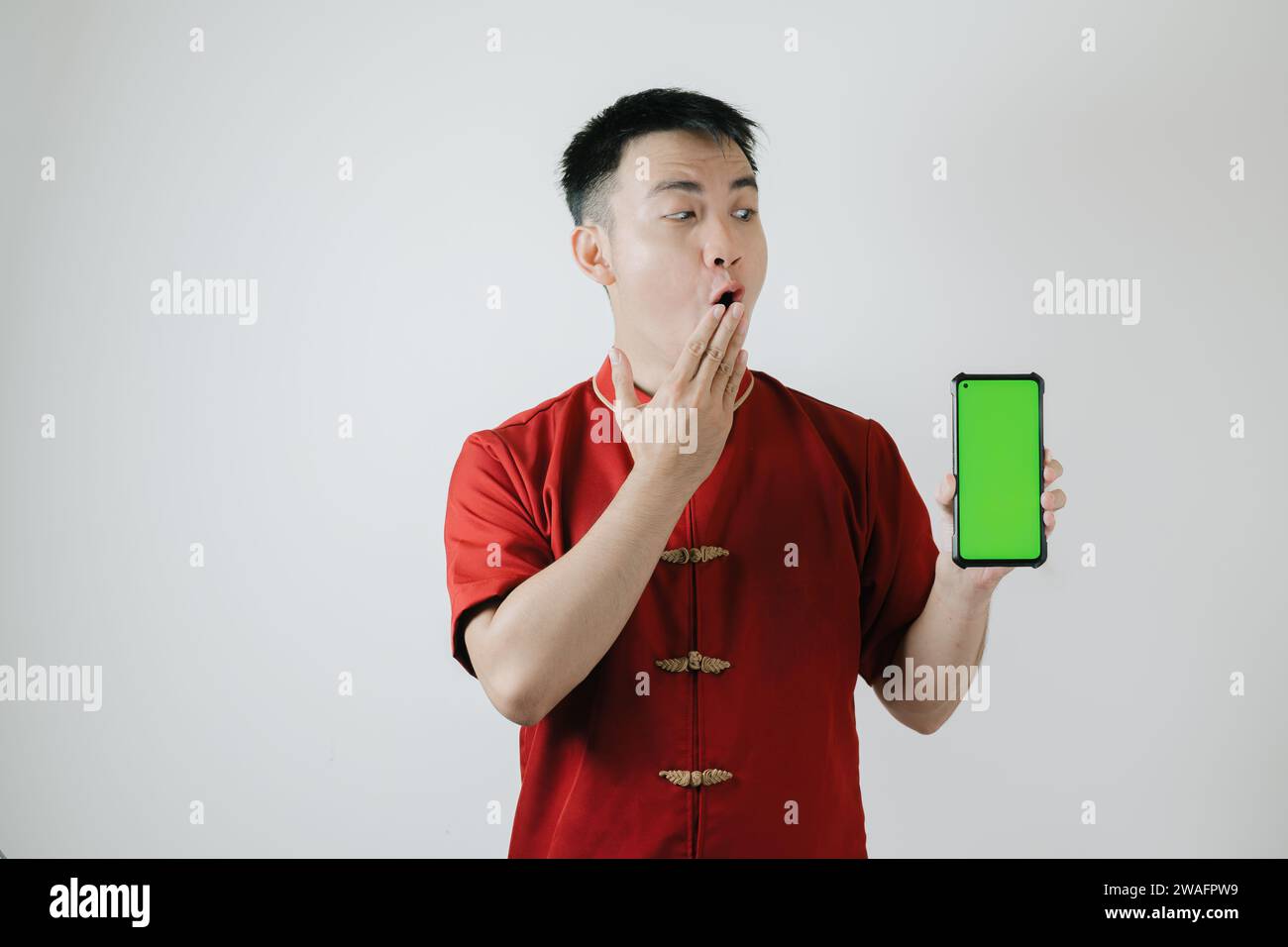 Shocked face of Asian man wearing Chinese traditional cloth or ...