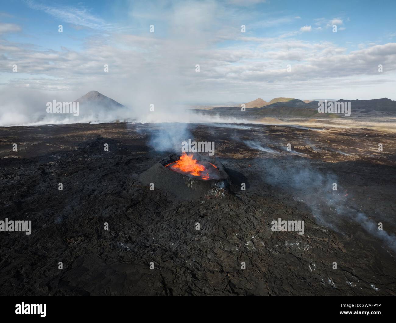 Stunning shot of dramatic moment of a volcano eruption, summit crater ...