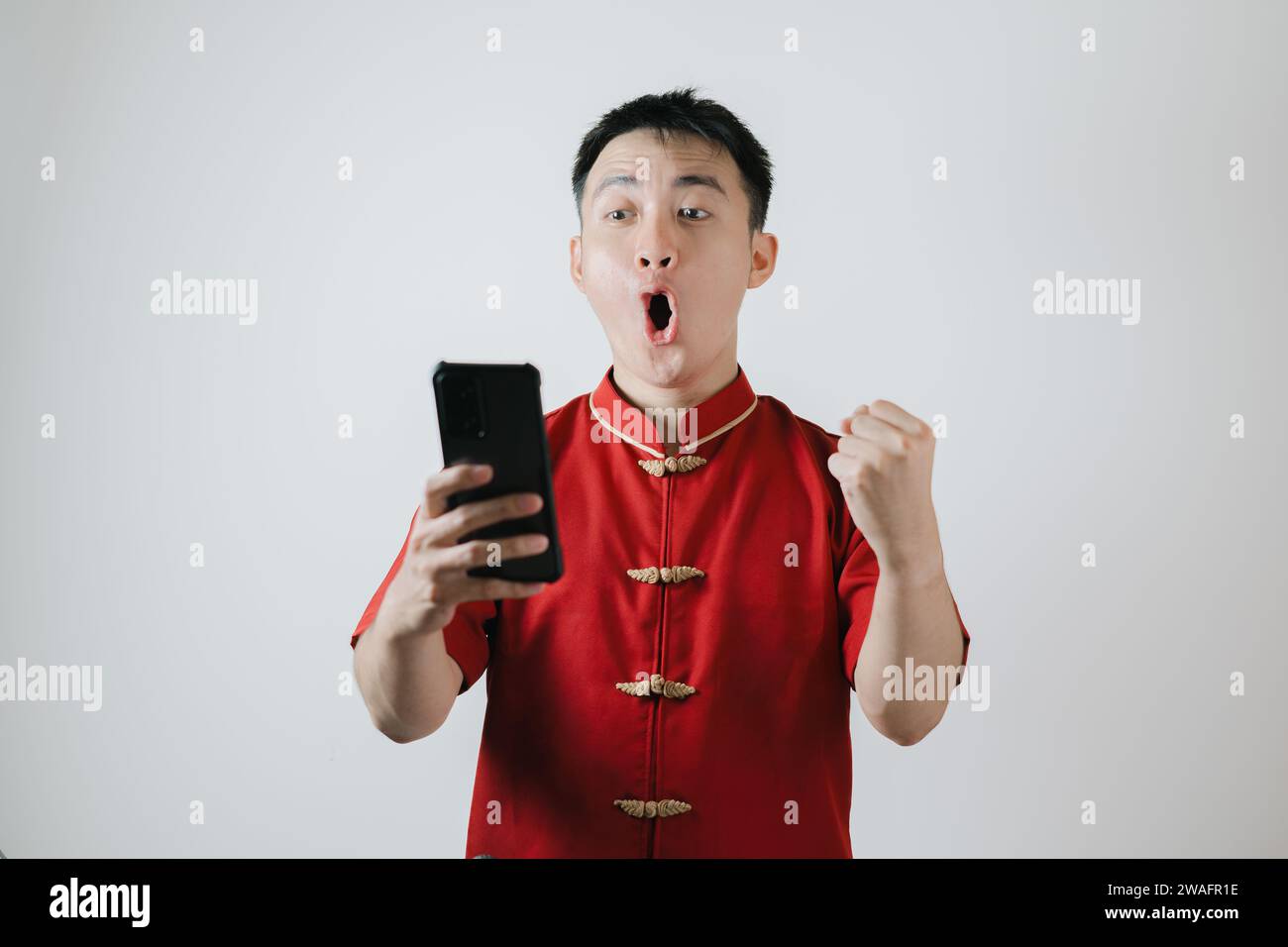 Shocked face of Asian man wearing Chinese traditional cloth or ...