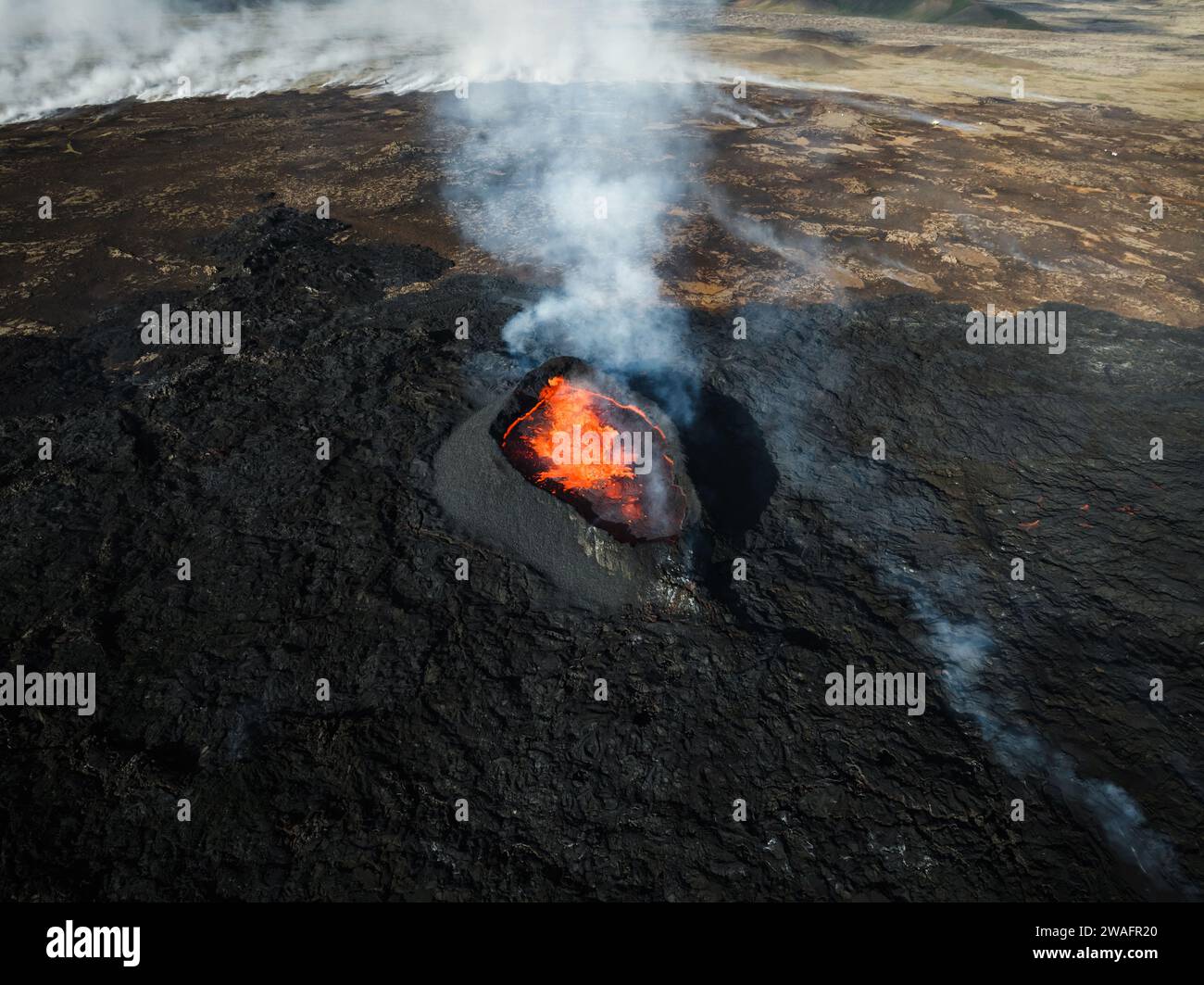 Apocalyptic surroundings of an erupted volcano, red hot lava boiling ...