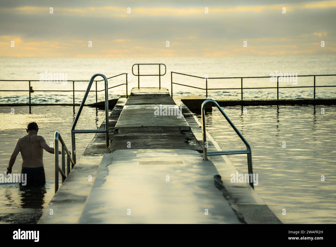 Man standing in ocean waves hi-res stock photography and images - Alamy