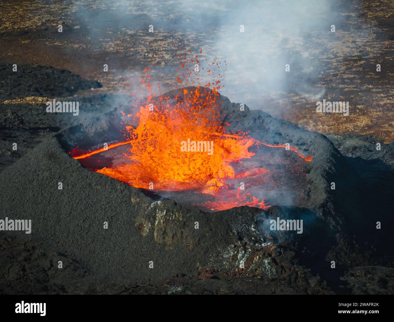 Awesome close up view of boiling red lava lake inside the active ...