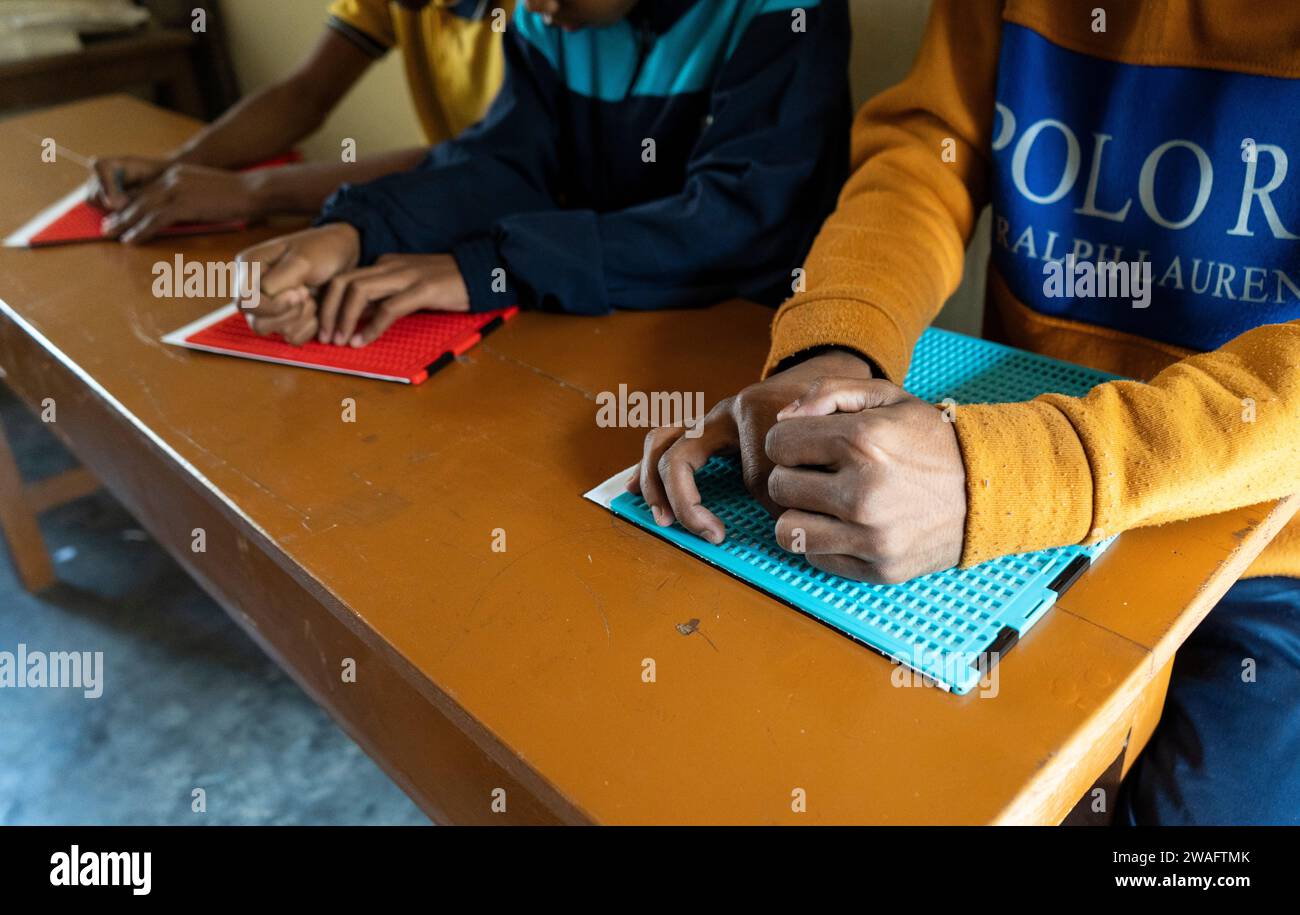 Visually impaired students writes using the Braille system at Guwahati ...