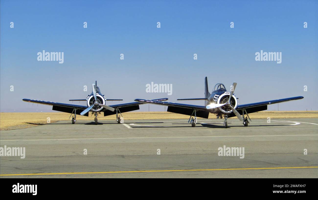 Two airplanes are standing side by side on the runway, ready for ...