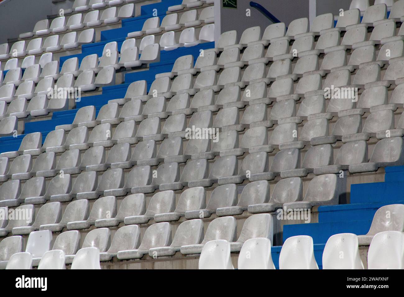 Stands in a soccer field where you can see the white and blue plastic ...