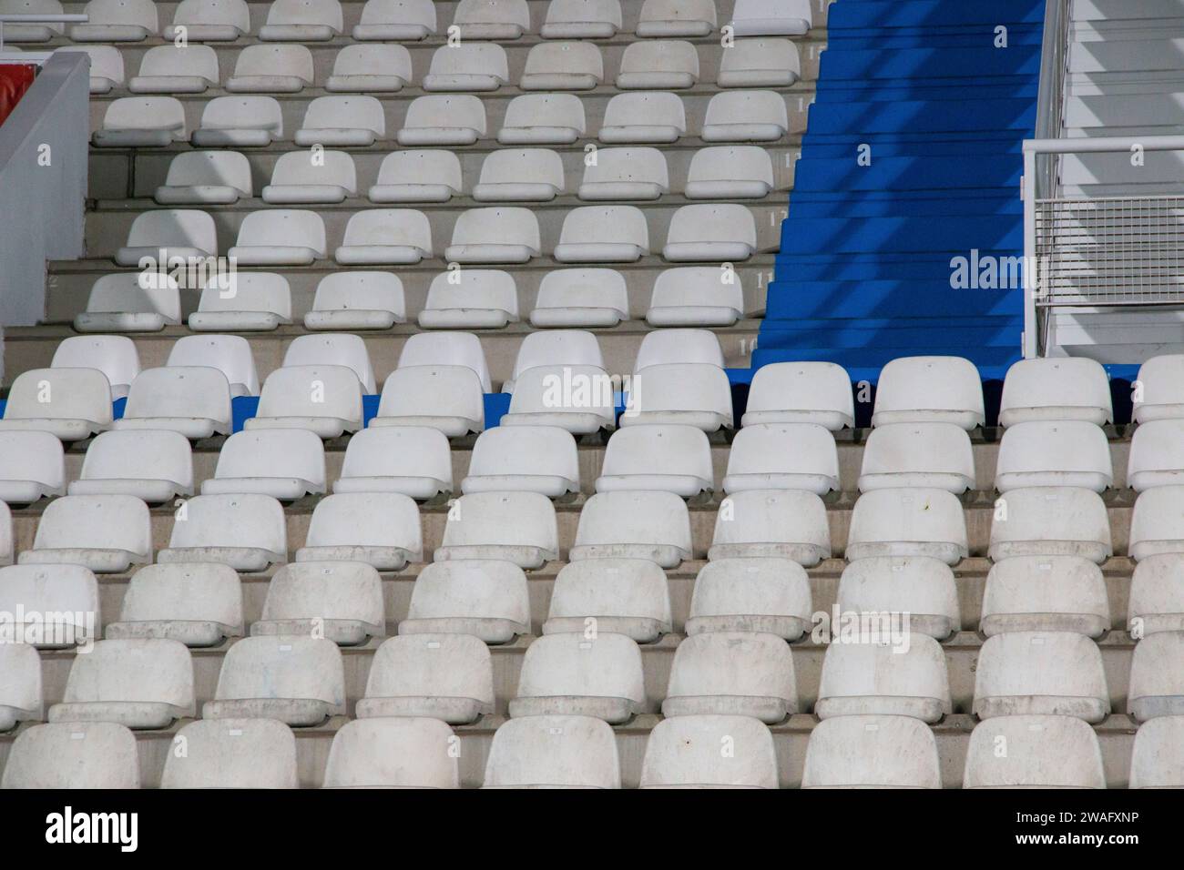 Stands in a soccer field where you can see the white and blue plastic ...