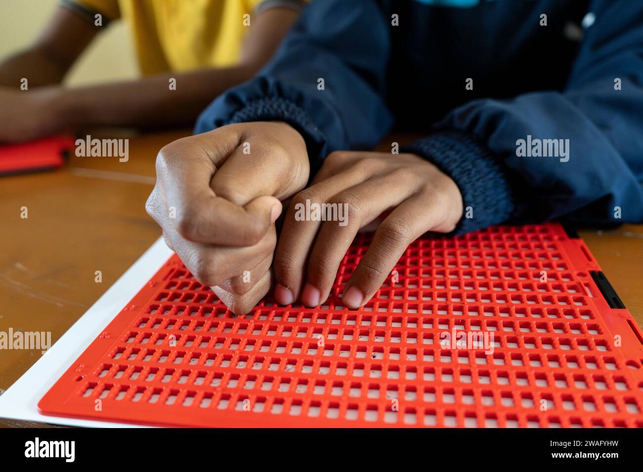 January 4, 2024: Visually impaired students writes using the Braille ...