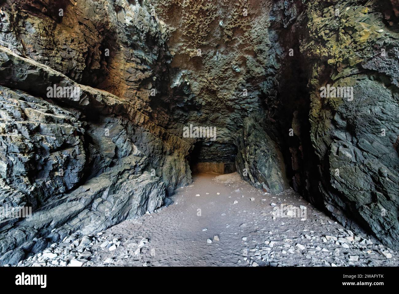 Tunnel excavated in volcanic rocks at rear of a sea cave in the Black ...