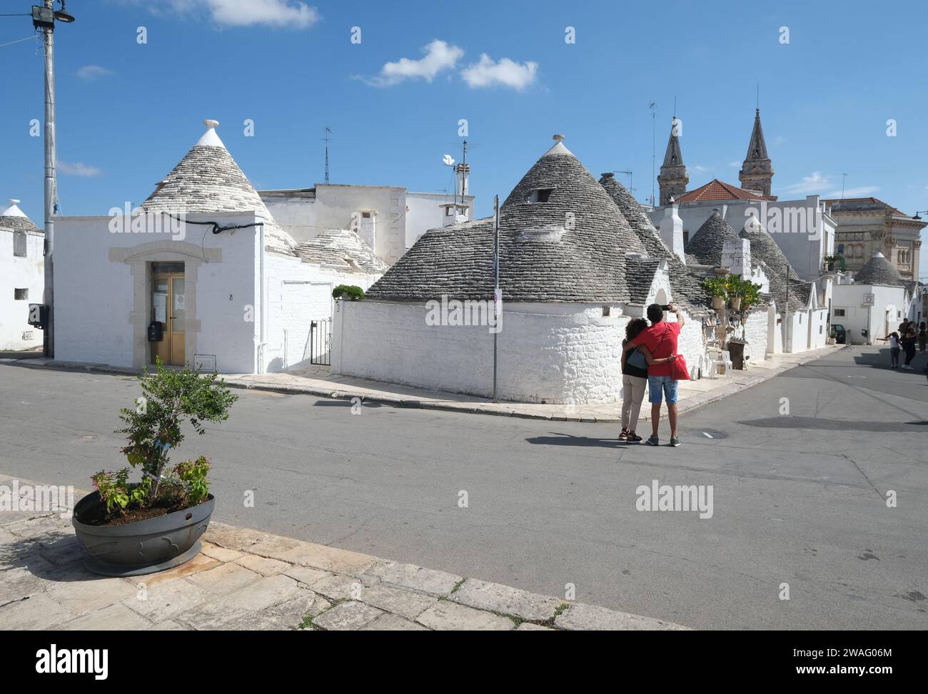 Tourists visit the city of Alberobello,Trulli houses are a UNESCO World ...