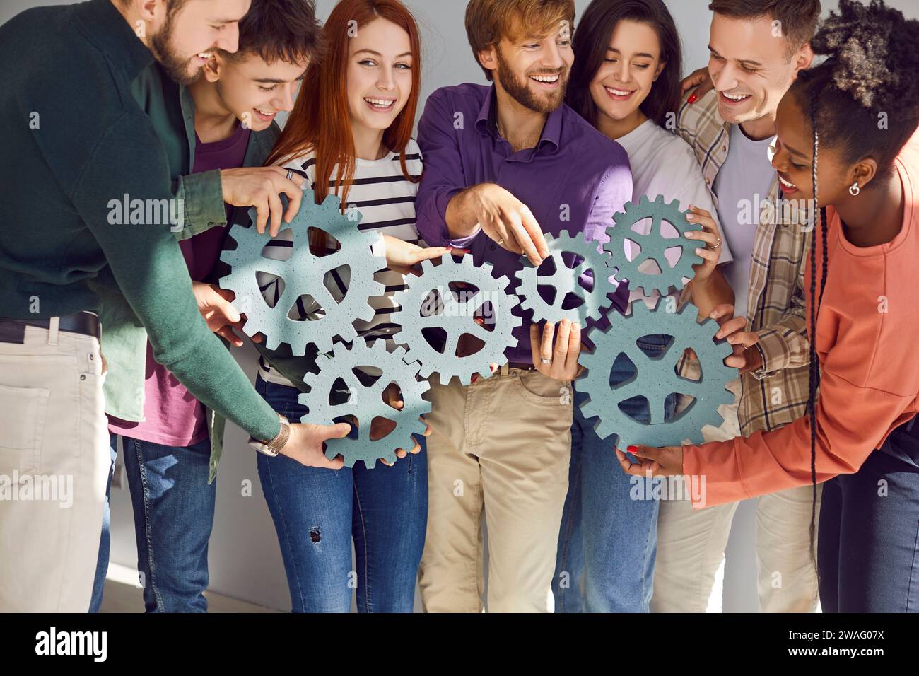 Smiling happy business team hi-res stock photography and images - Alamy