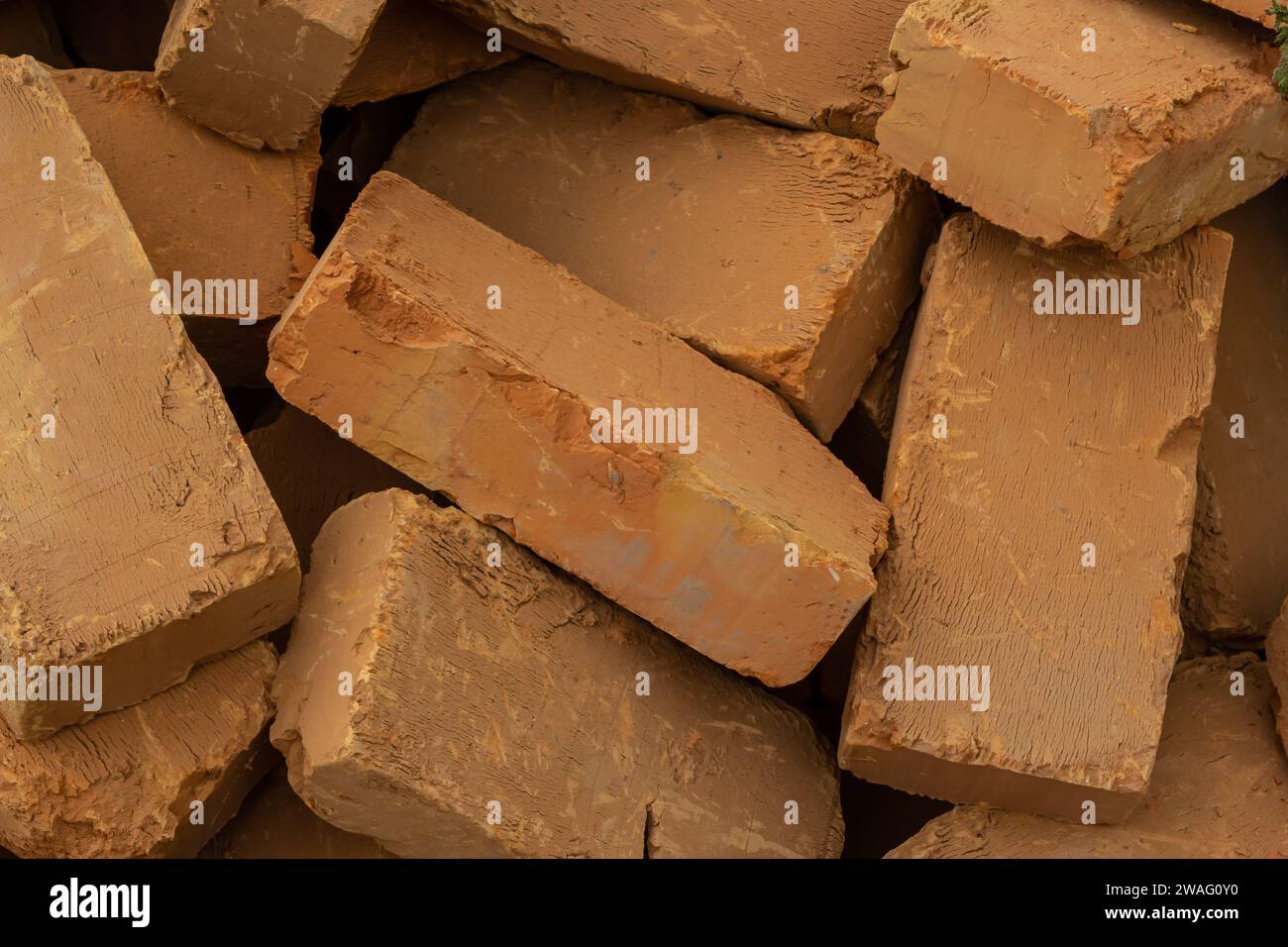 Solid clay brick used for construction. Background, brown red color ...