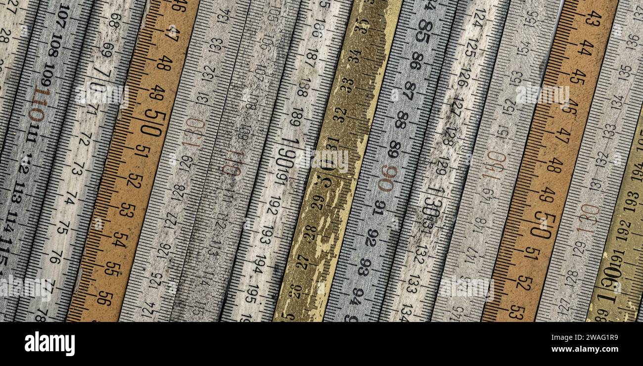 A variety of vintage wooden folding rulers arranged Stock Photo - Alamy