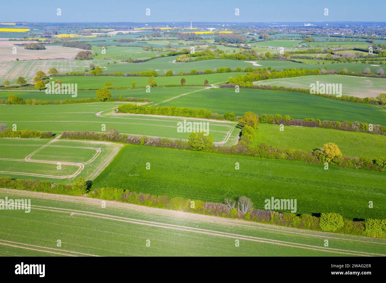 Aerial view over rural bocage landscape with fields and pastures ...