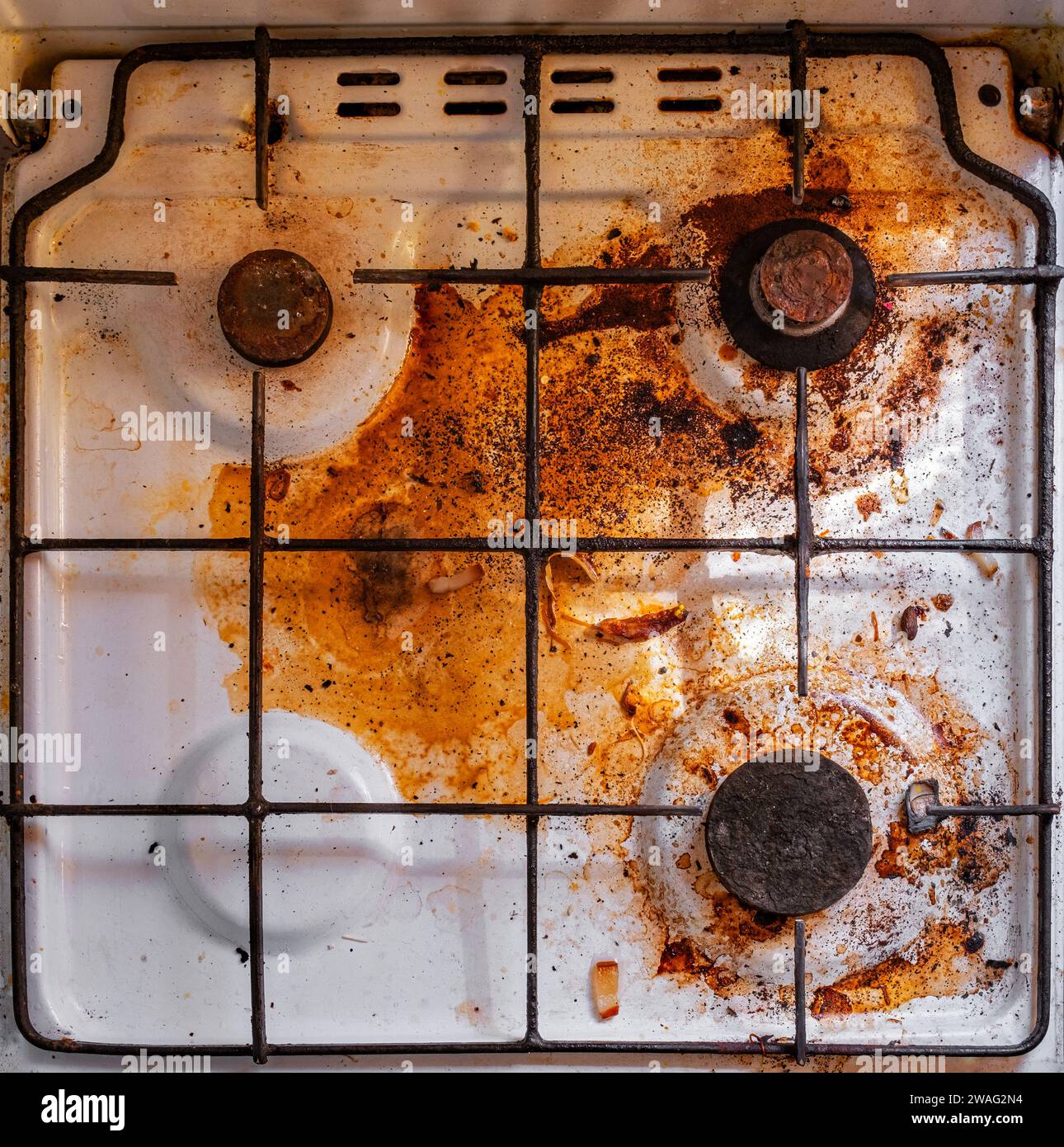 Dirty stove with food leftovers. Unclean gas kitchen cooktop with ...