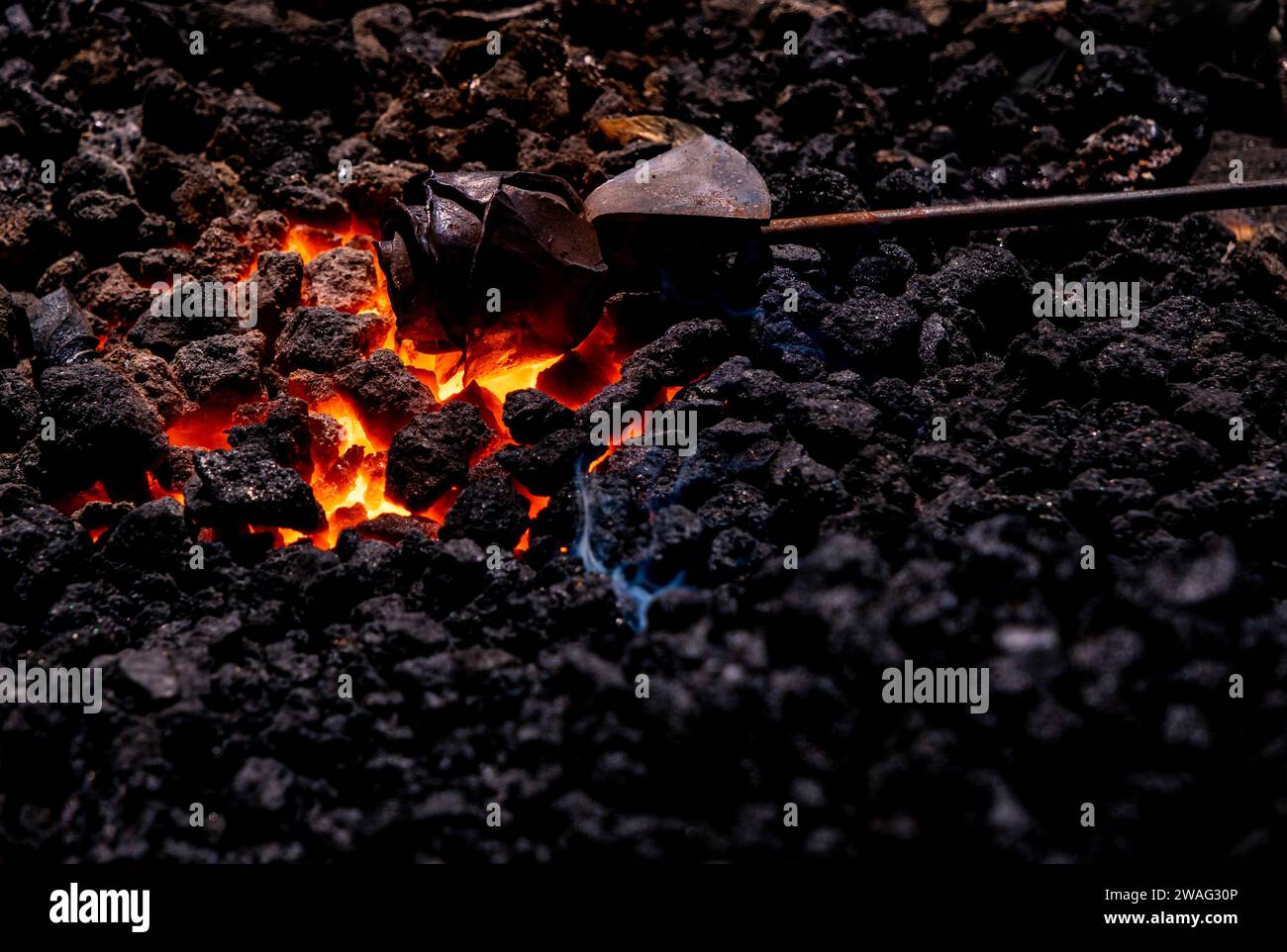 forging metal in blacksmith workshop Stock Photo - Alamy