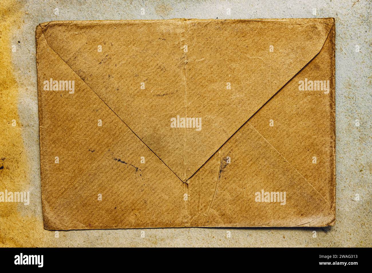 front view closeup of blank old aged closed letter paper envelope with ...