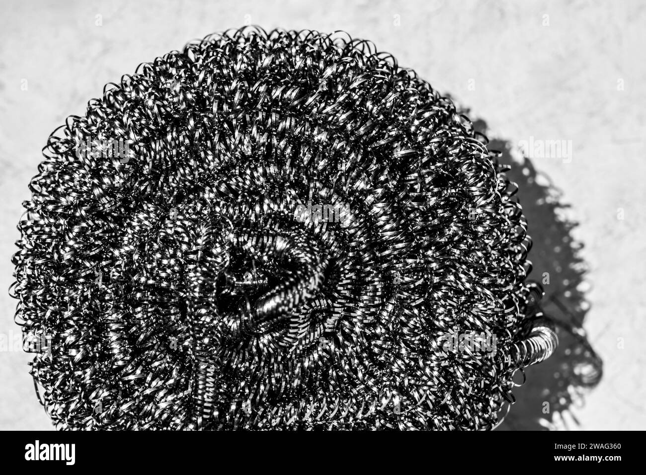 Metal dishwashing sponge on table Stock Photo - Alamy