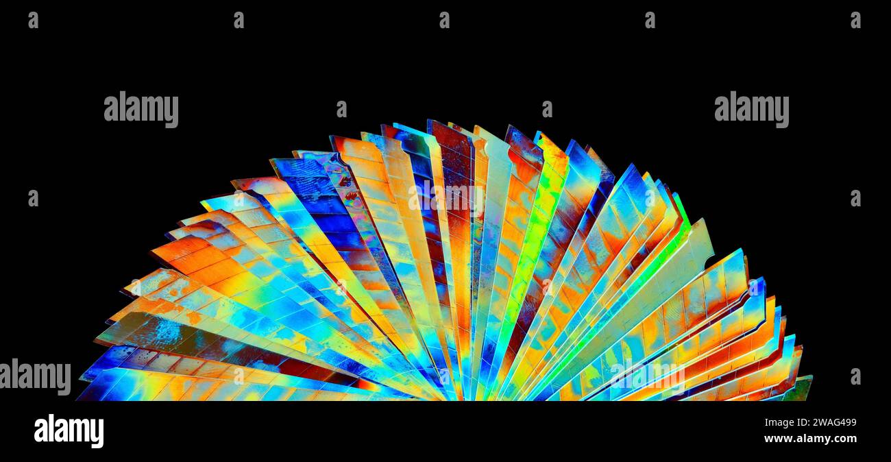 utility knife blades, heated in the fire arranged in the form of fan on ...