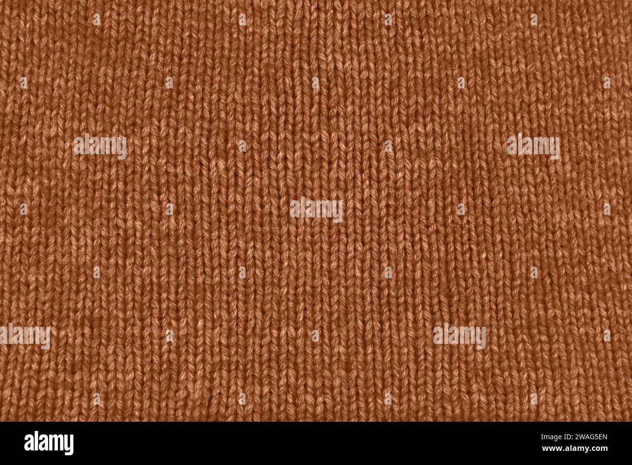 Background textile fabric with knitted wool texture in peach color ...