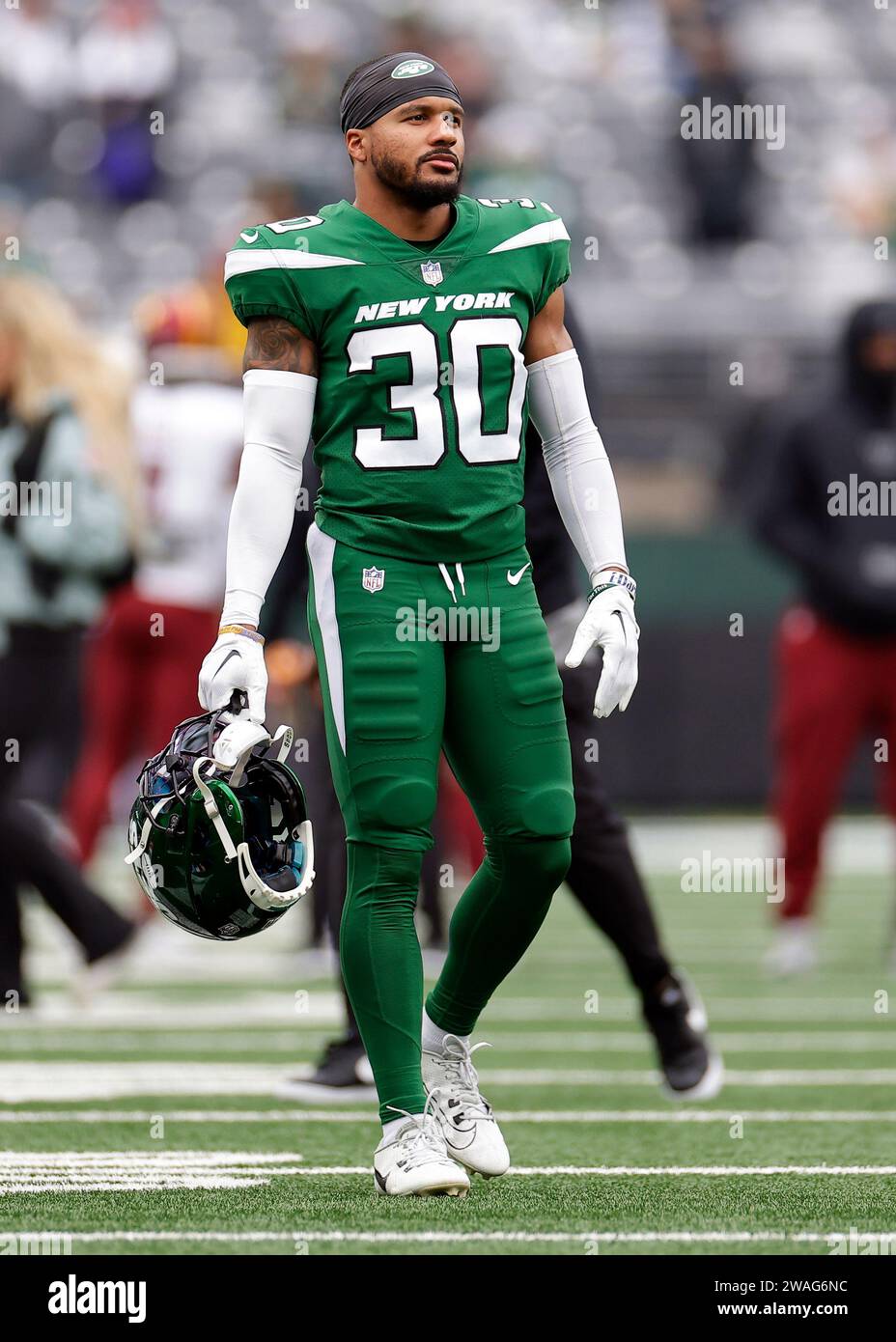 New York Jets cornerback Michael Carter II (30) warms up before facing ...