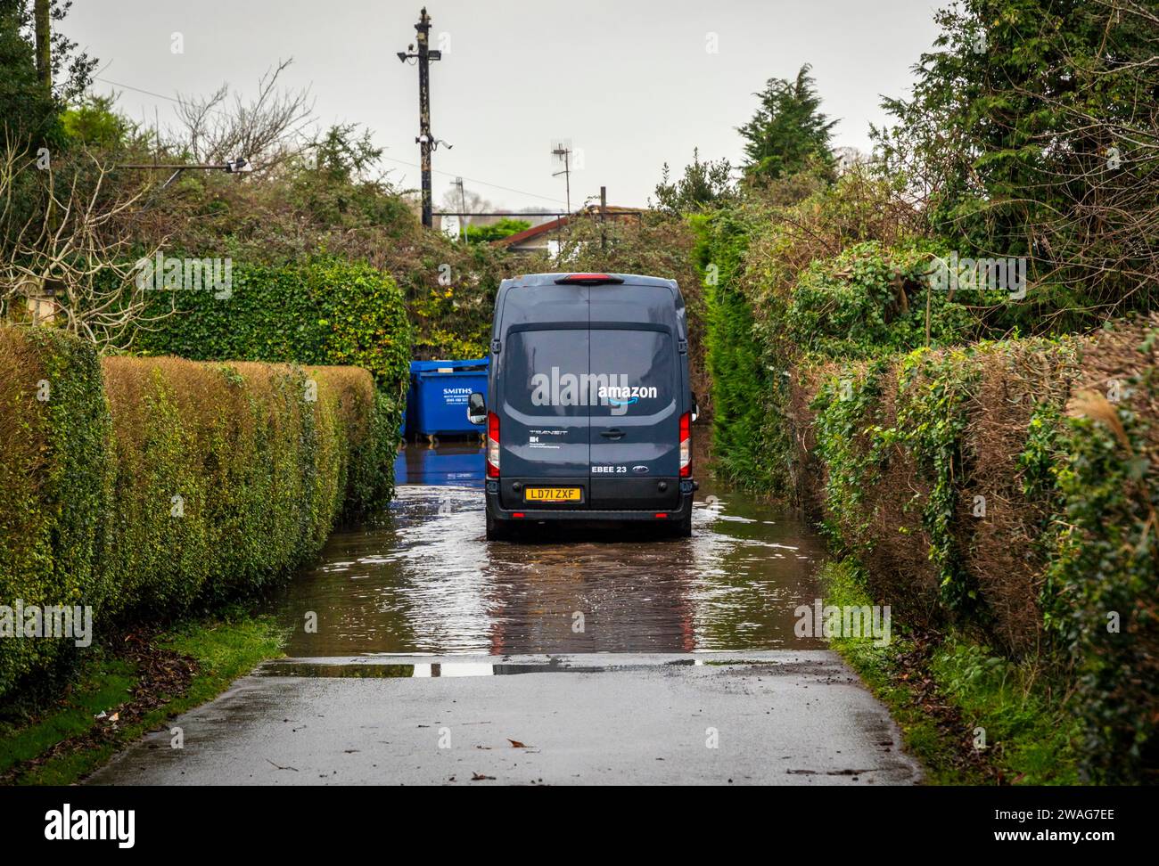 Amazon delivery van drives through floods in Worcestershire, January ...