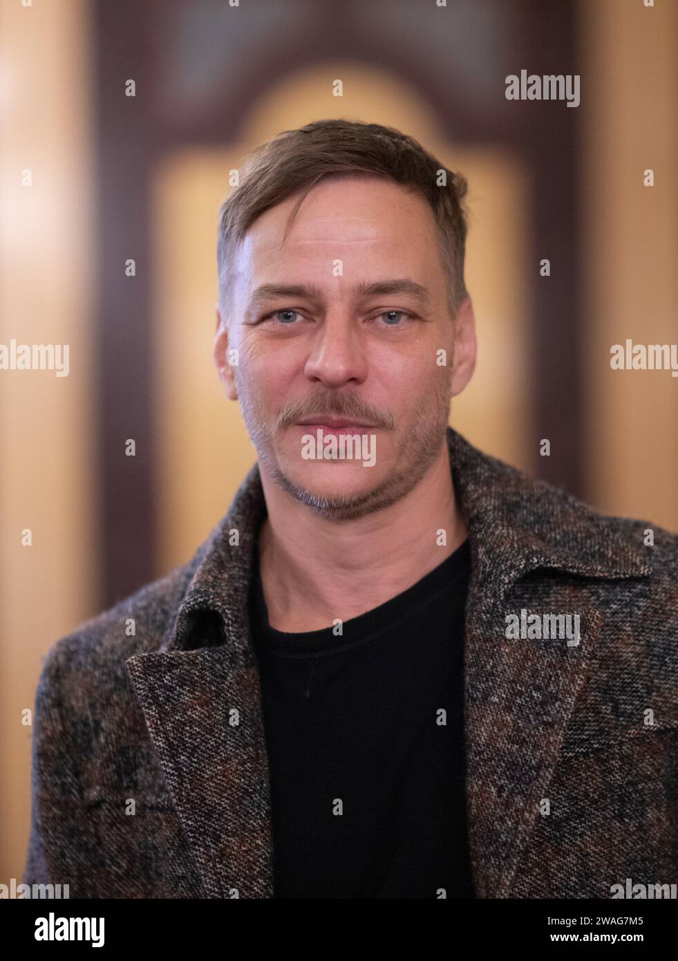 Dresden, Germany. 04th Jan, 2024. Actor Tom Wlaschiha stands in the ...
