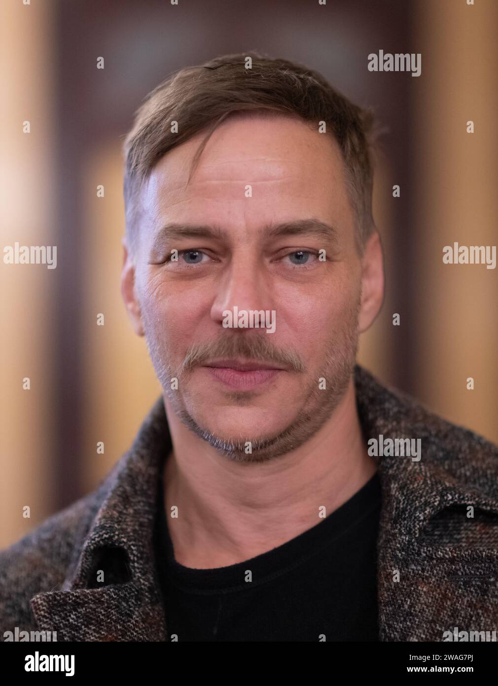 Dresden, Germany. 04th Jan, 2024. Actor Tom Wlaschiha stands in the ...