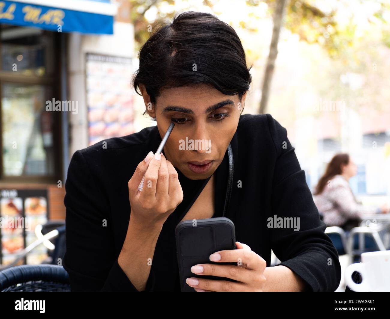 Transgender woman makeup in the street Stock Photo - Alamy